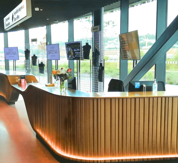 Swansea Arena Reception Desk in Aged Brass with Perforated Panel
